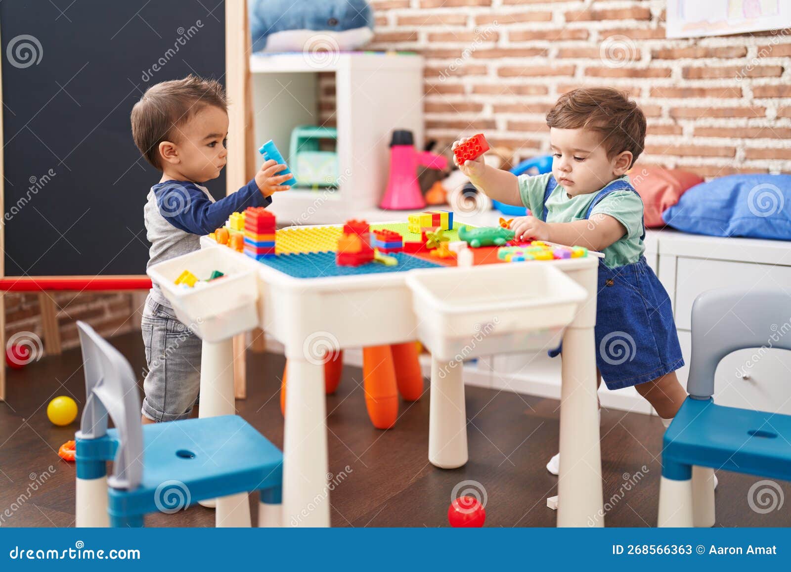 Two Kids Playing with Construction Blocks Standing at Kindergarten ...