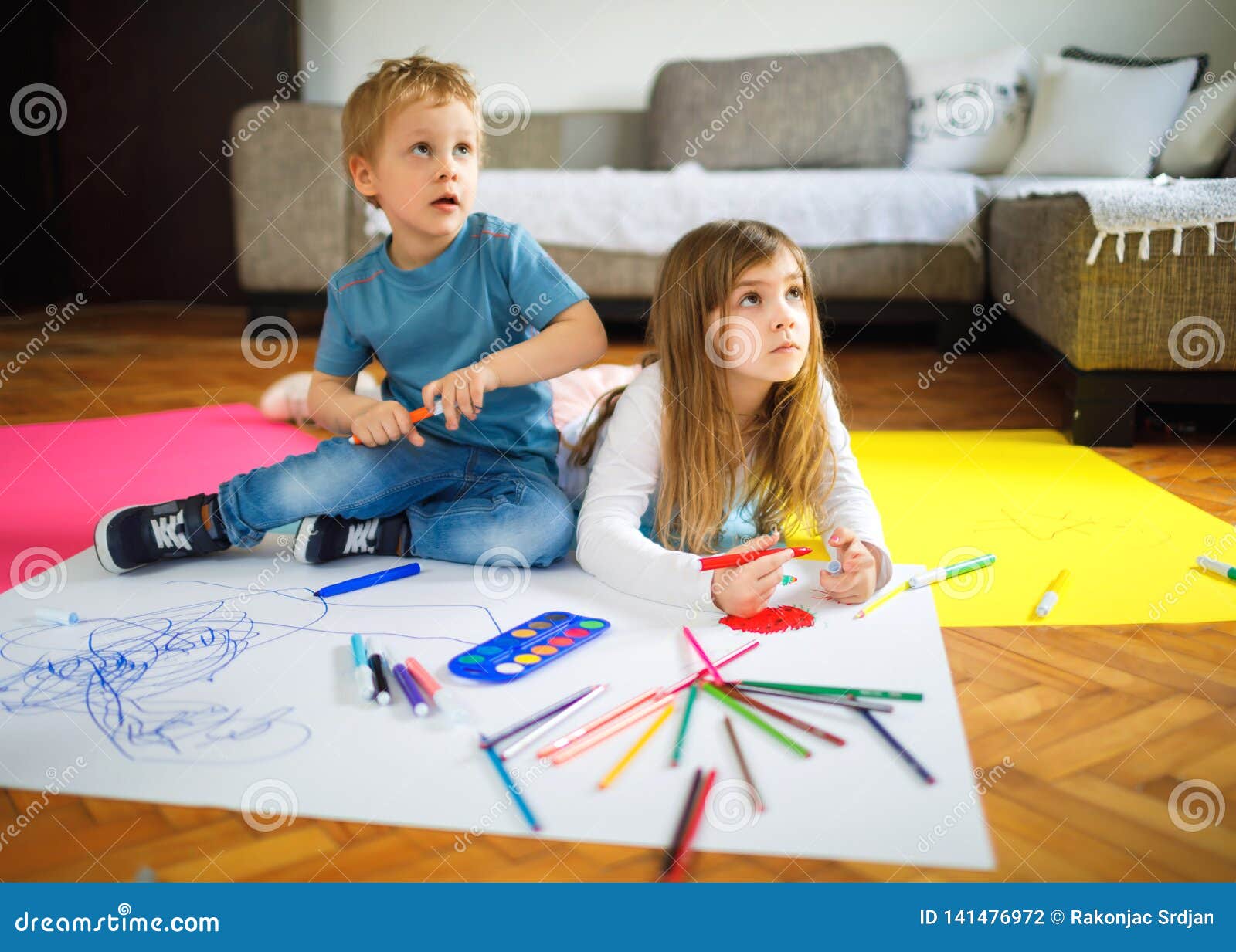 Two Kids are Playing and Drawing on the Floor. Stock Photo - Image of ...