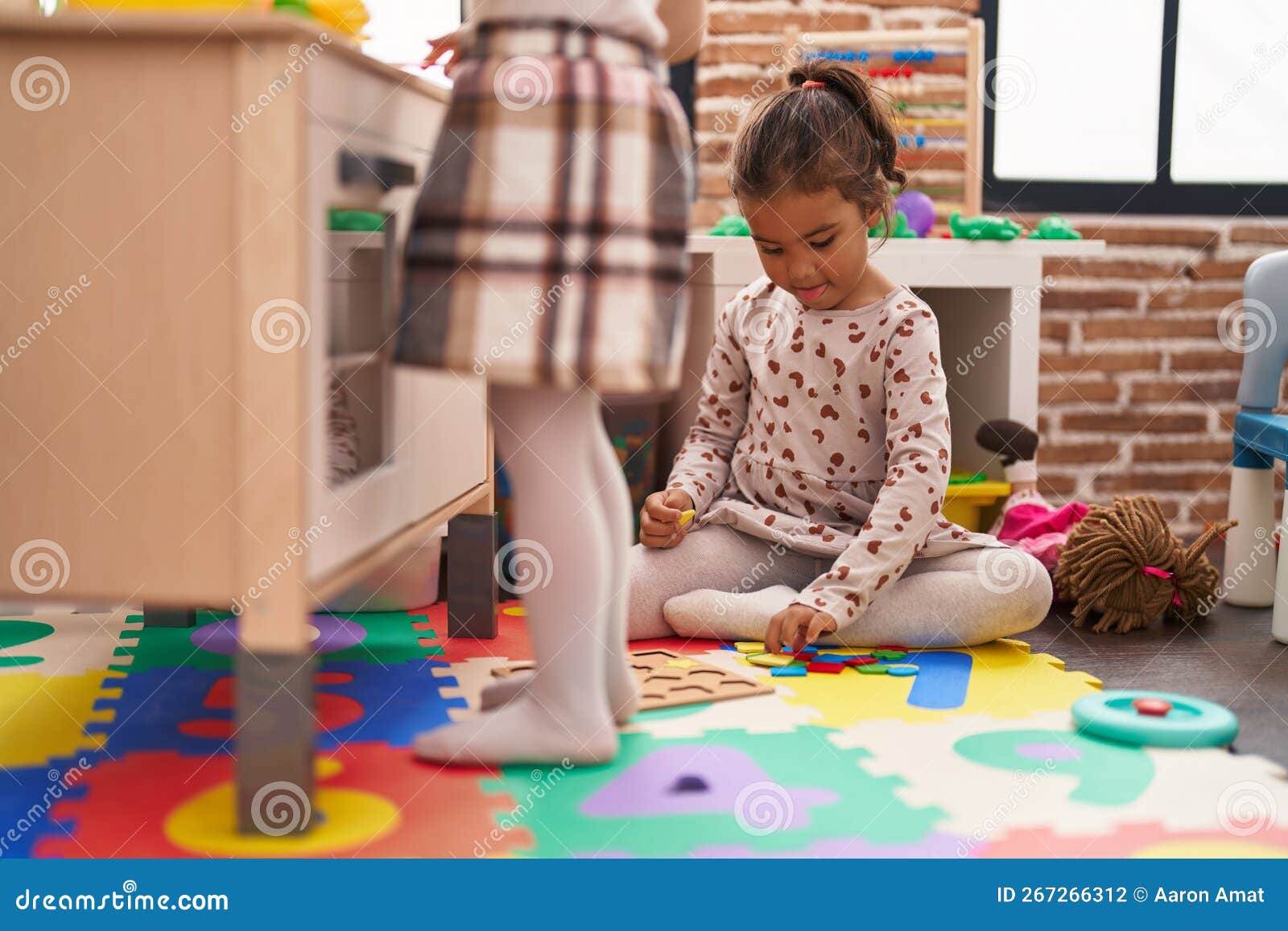 Two Kids Playing with Play Kitchen and Maths Puzzle Game at ...