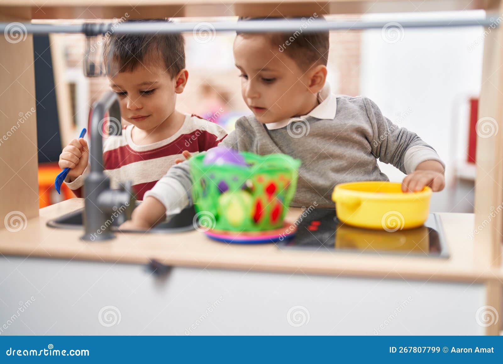 Two Kids Playing with Play Kitchen Standing at Kindergarten Stock Image ...