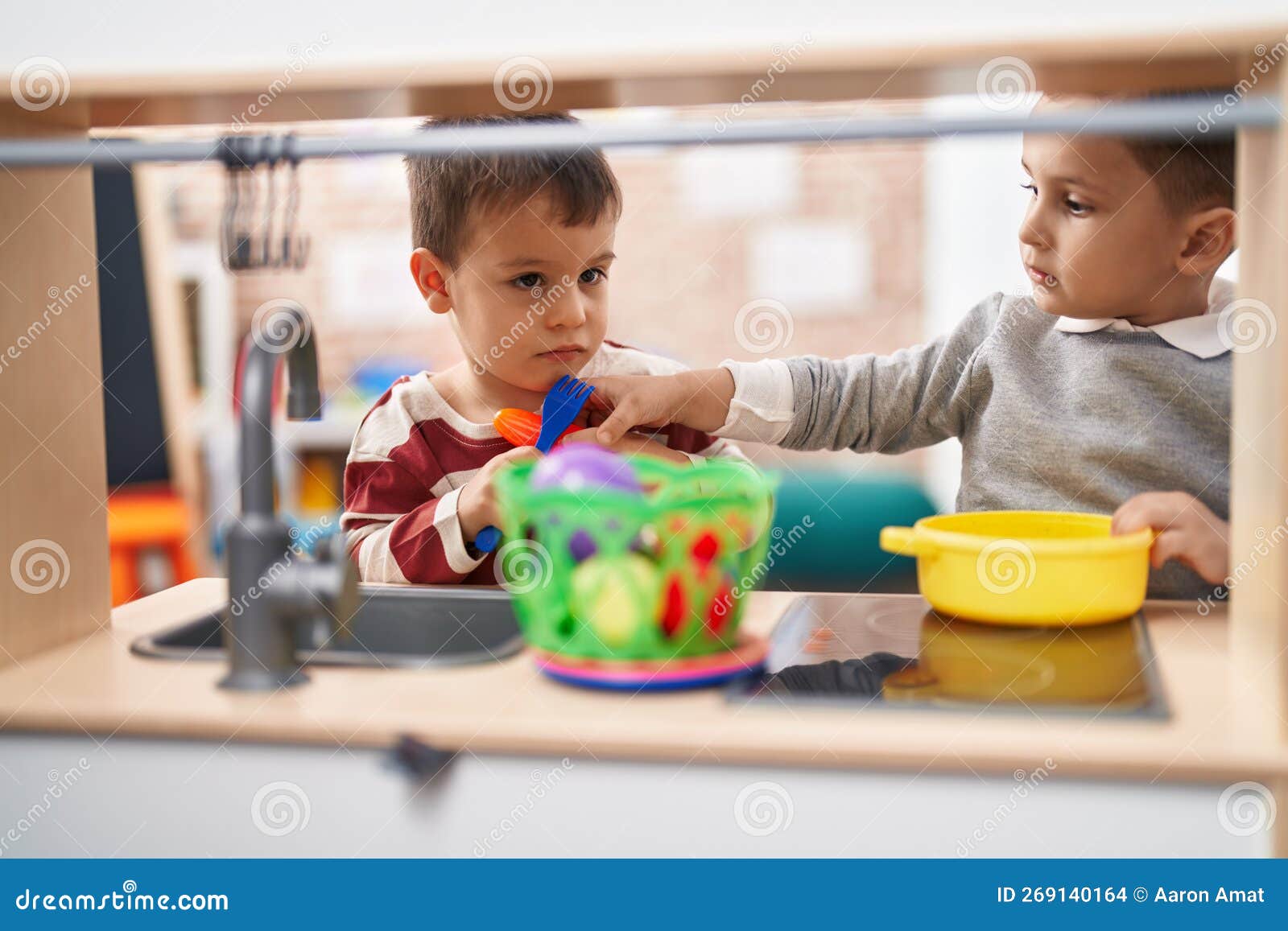 Two Kids Playing with Play Kitchen Standing at Kindergarten Stock Photo ...