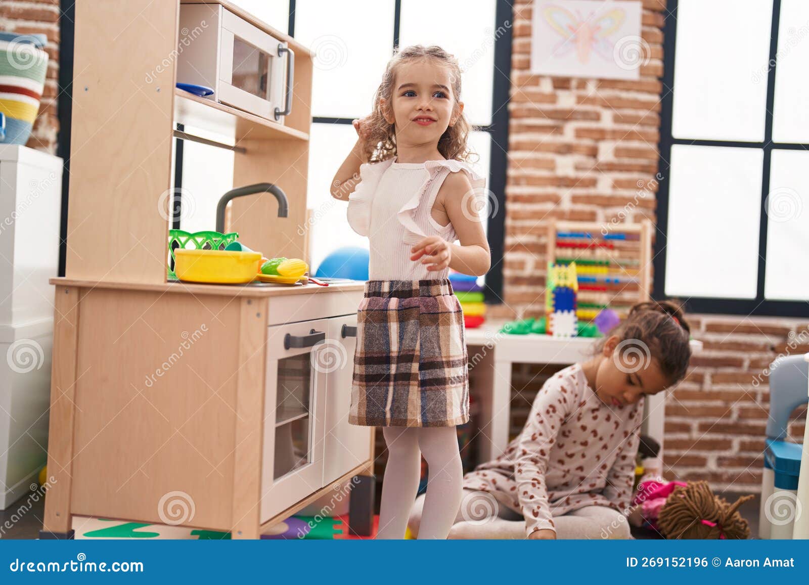 Two Kids Playing with Play Kitchen Standing at Kindergarten Stock Photo ...