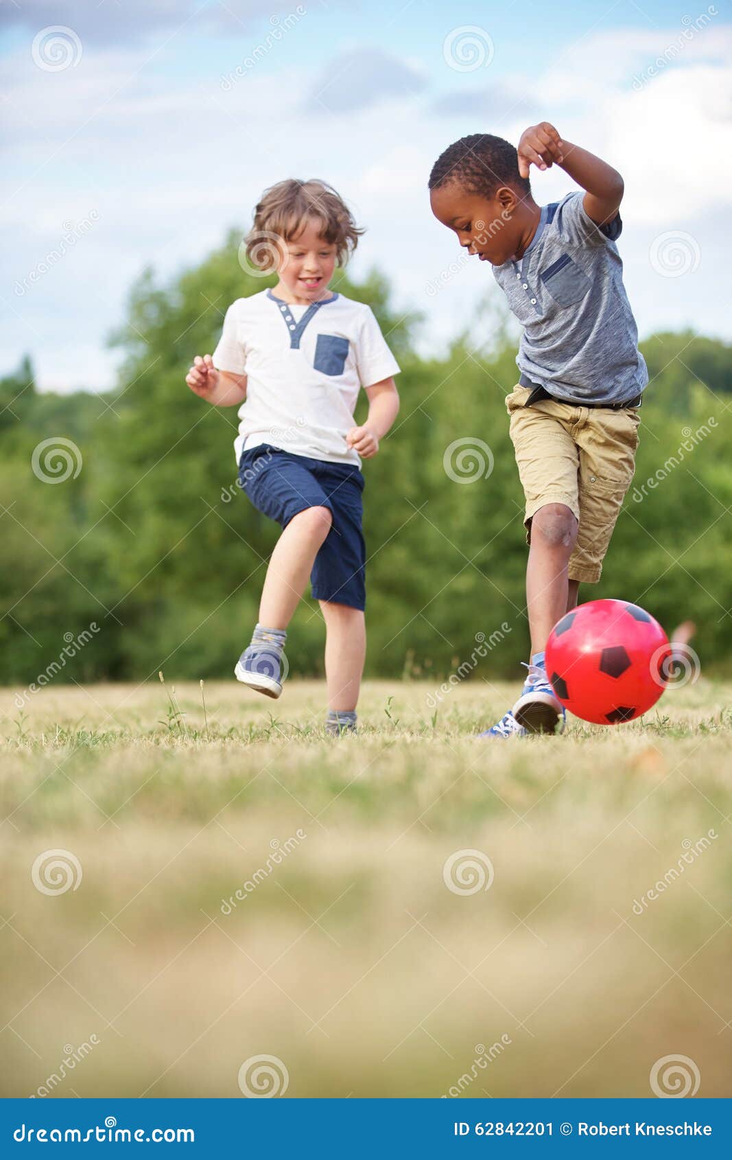 Two kids playing soccer stock image. Image of football - 62842201