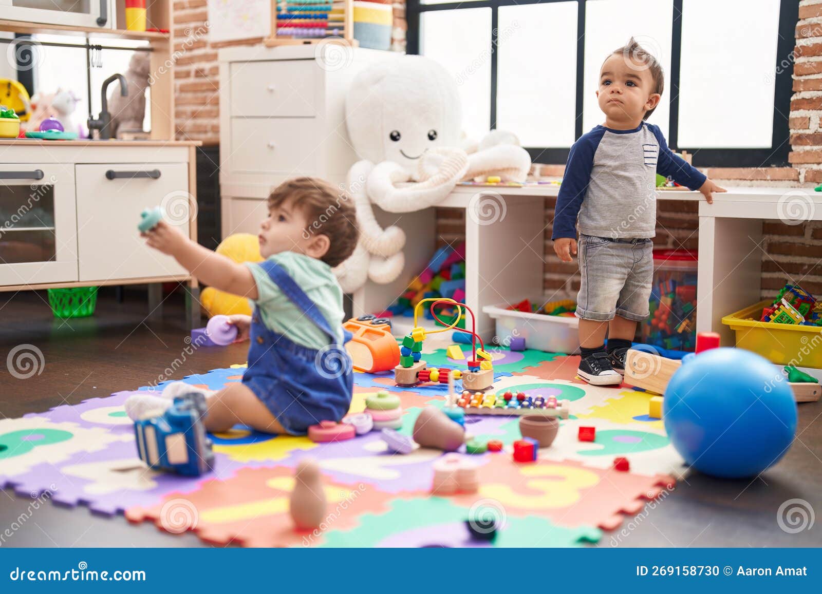 Two Kids Playing with Toys at Kindergarten Stock Photo - Image of floor ...