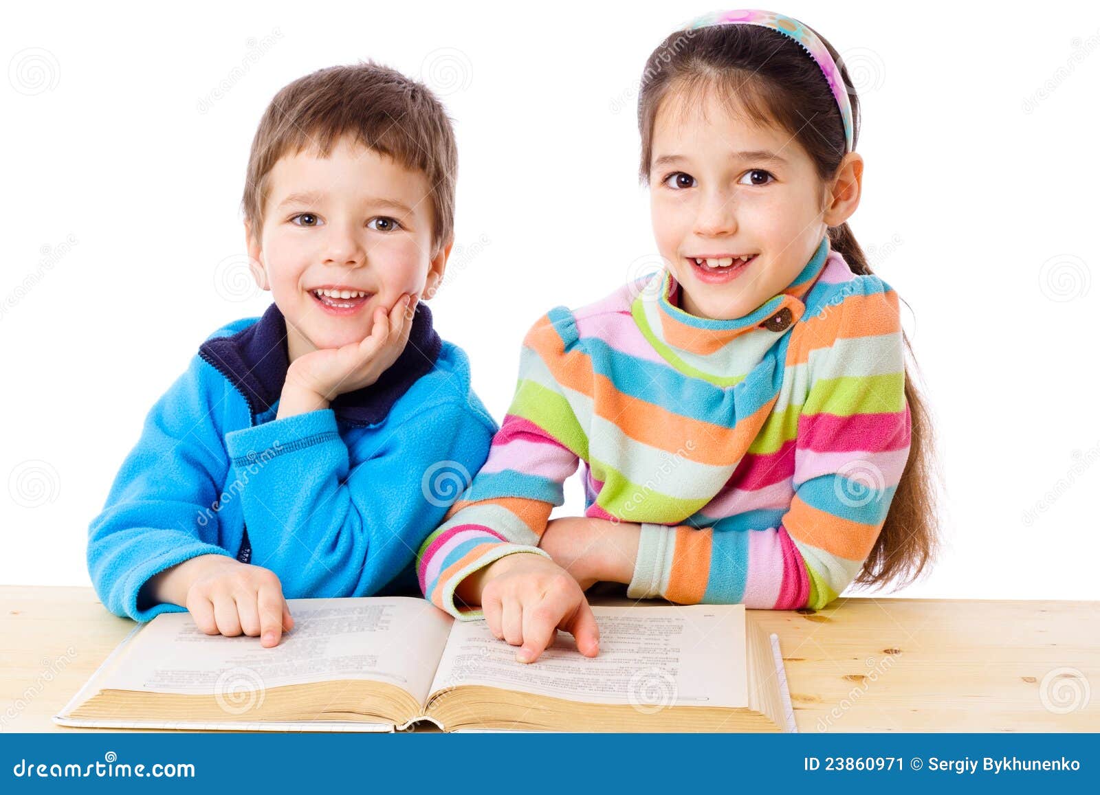 Two kids reading the book stock image. Image of desk - 23860971