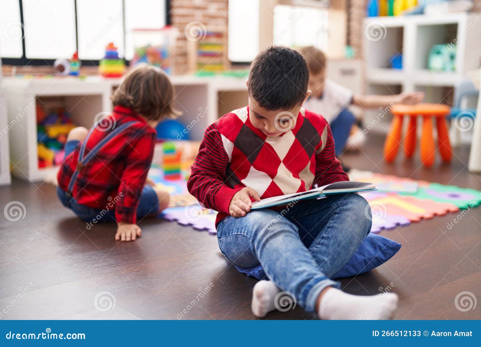 Two Kids Reading Book Sitting on Floor at Kindergarten Stock Image ...