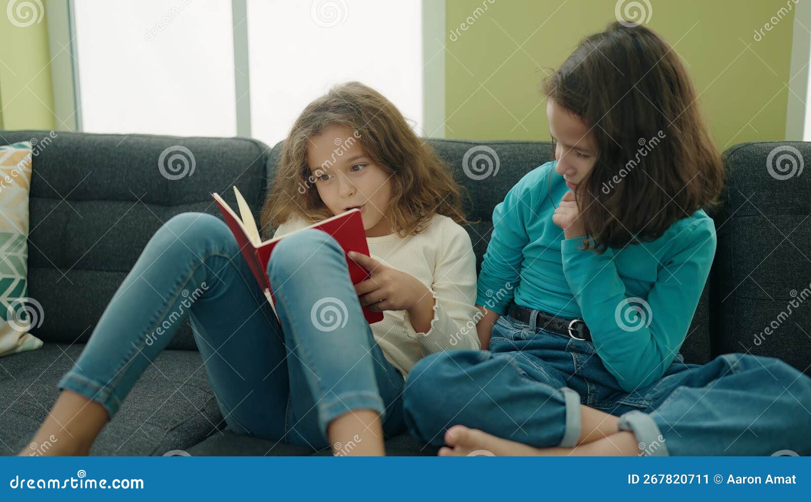 Two Kids Reading Book Sitting on Sofa at Home Stock Image - Image of ...