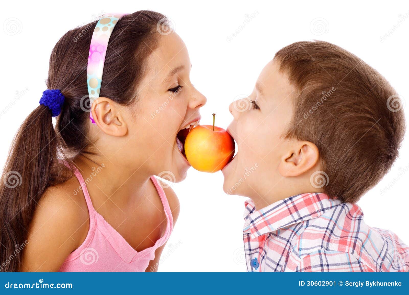 Two kids sharing the apple stock image. Image of little - 30602901