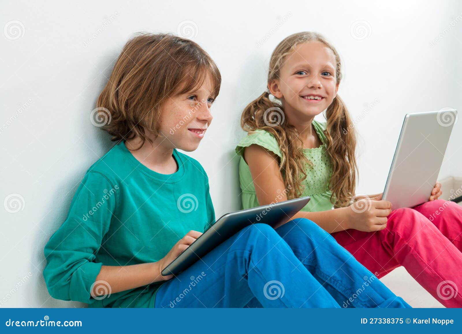 Two Kids Sitting with Laptop and Digital Tablet. Stock Image - Image of ...