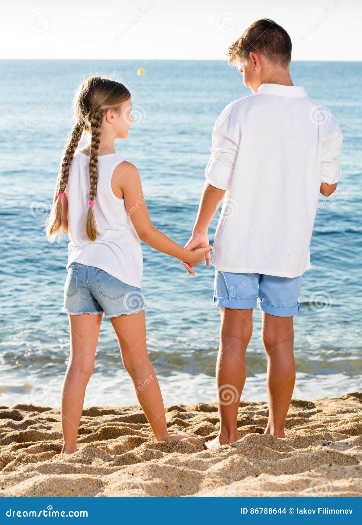 Two kids standing back stock photo. Image of friends - 86788644