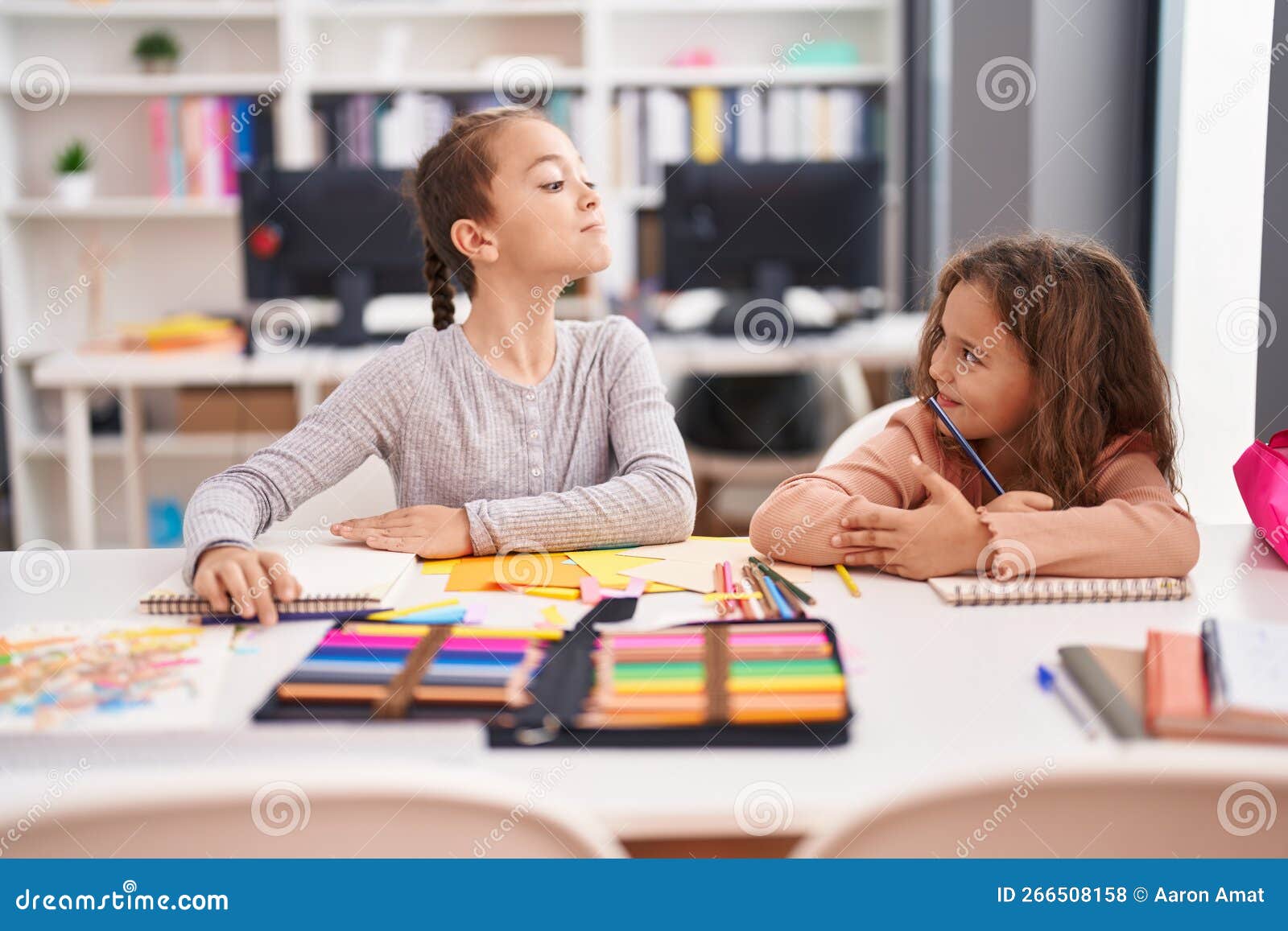 Two Kids Students Sitting on Table Drawing on Notebook Paper at ...