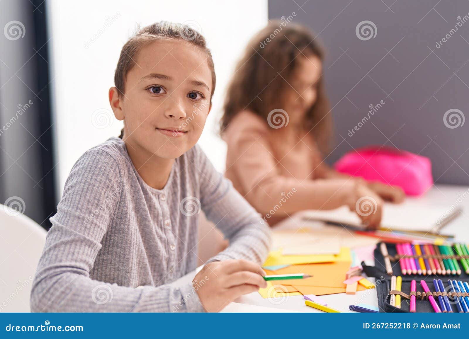 Two Kids Students Sitting on Table Drawing on Notebook Paper at ...