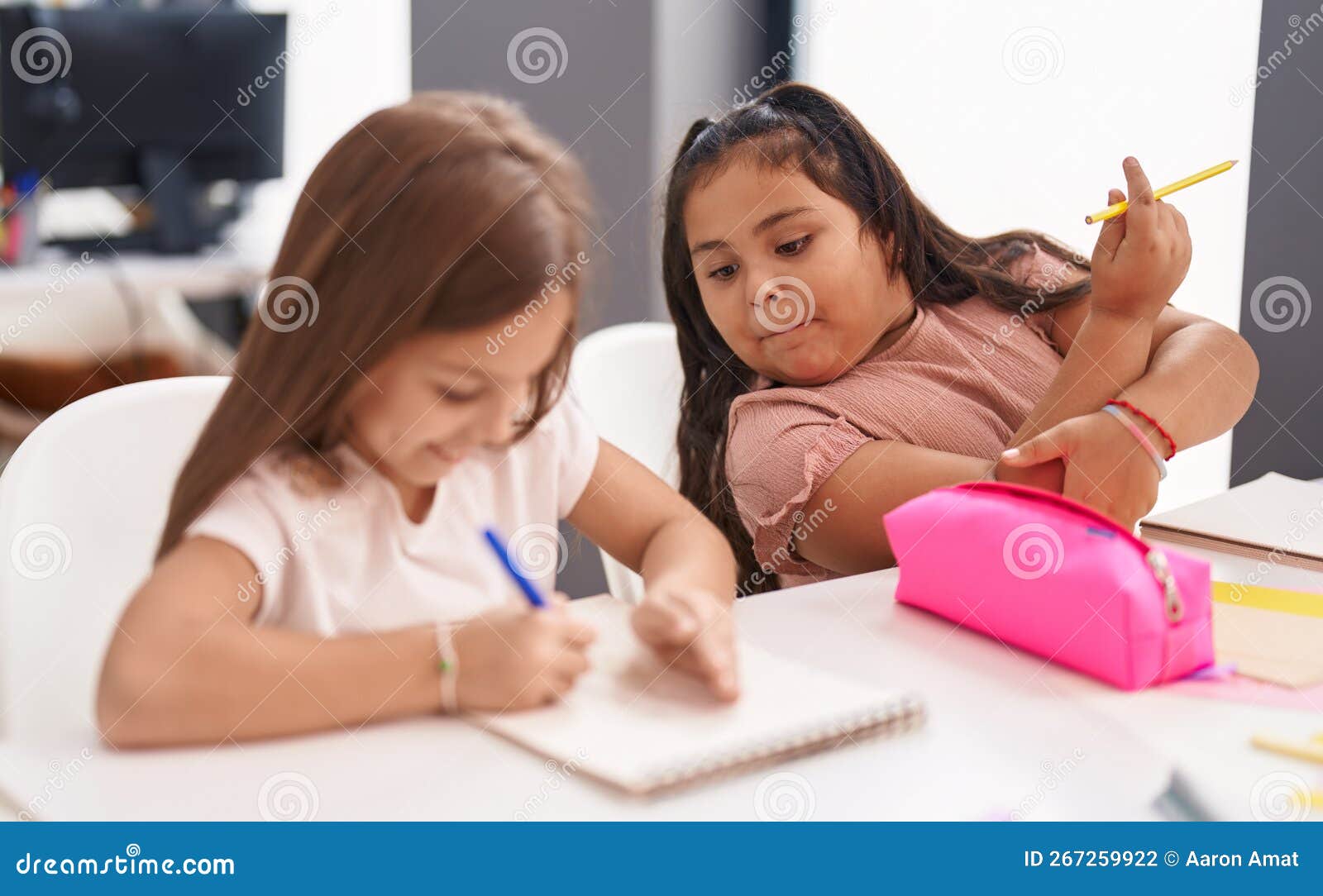 Two Kids Students Sitting on Table Drawing on Notebook Paper at ...