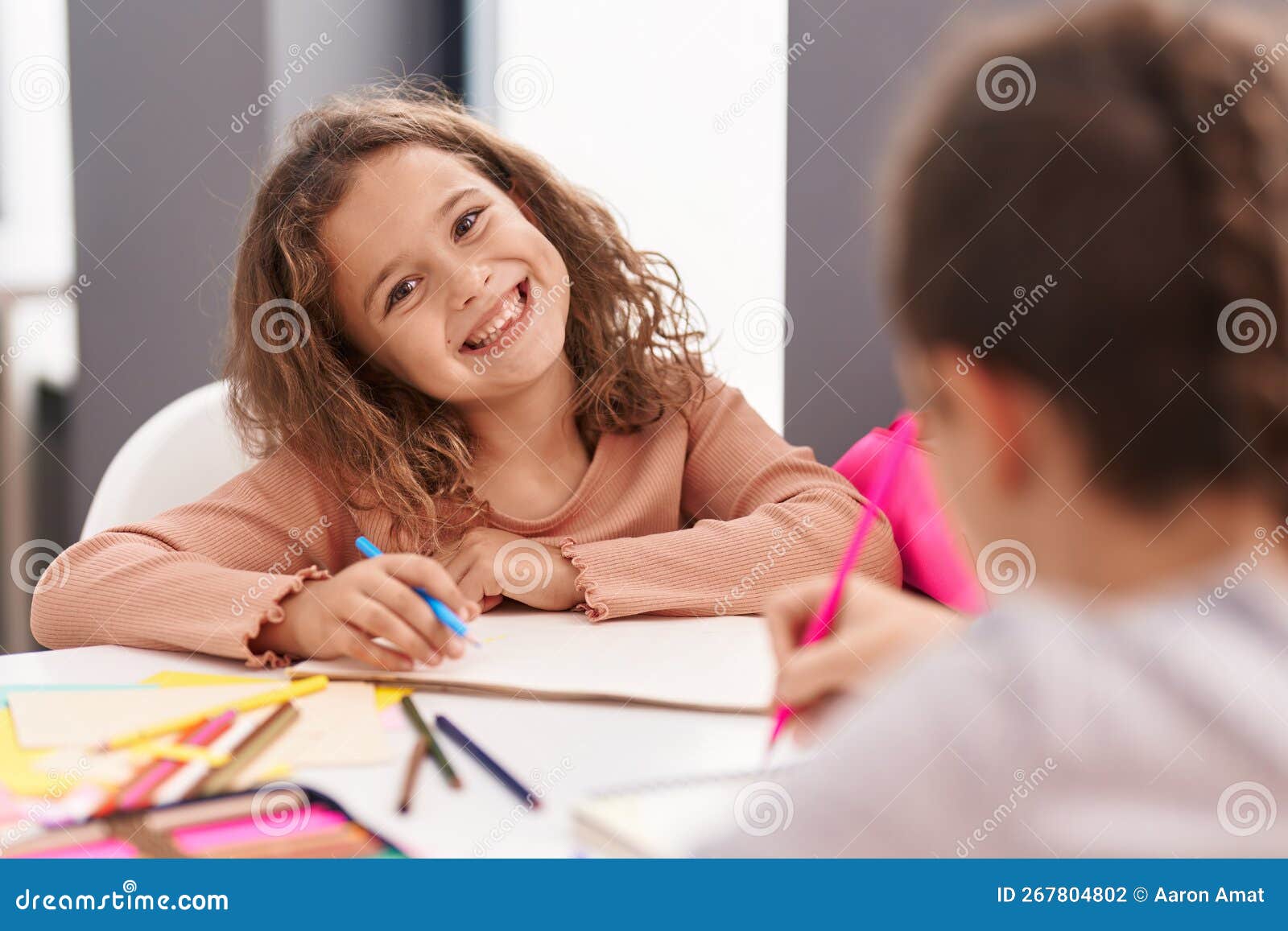 Two Kids Students Sitting on Table Drawing on Notebook Paper at ...