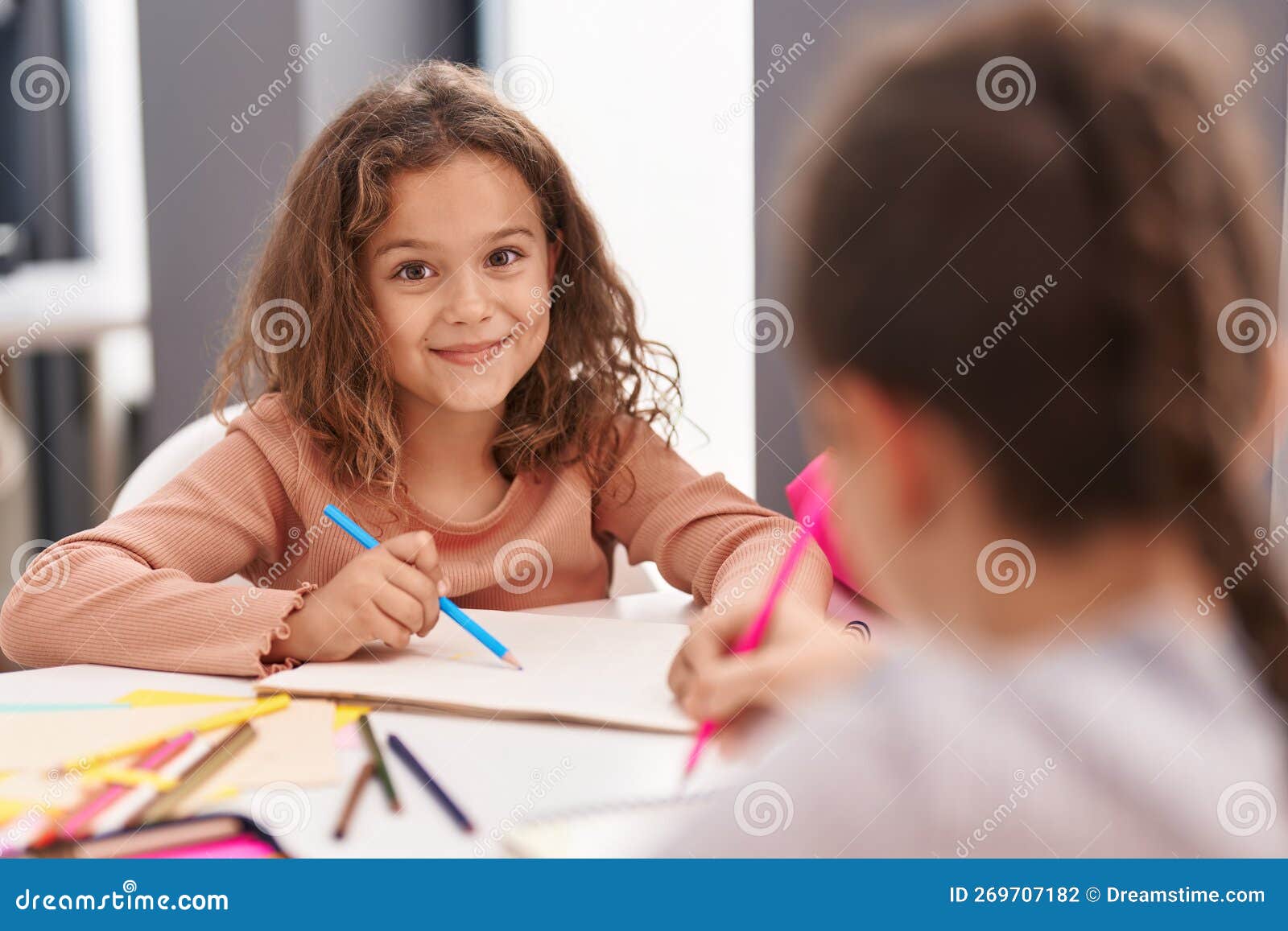 Two Kids Students Sitting on Table Drawing on Notebook Paper at ...