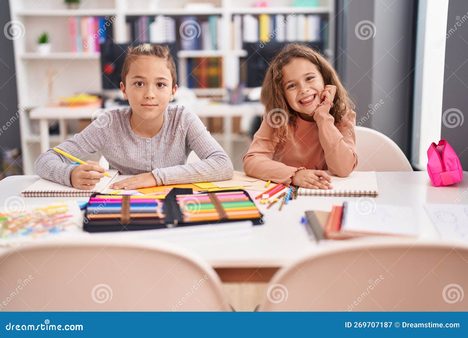 Two Kids Students Sitting on Table Drawing on Notebook Paper at ...