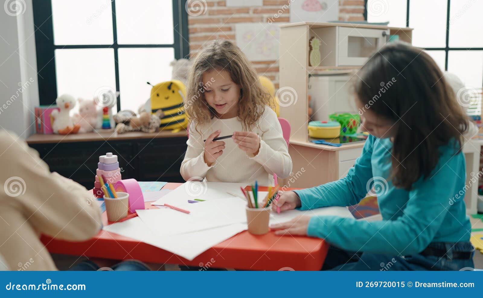 Two Kids Students Sitting on Table Drawing on Paper at Kindergarten ...