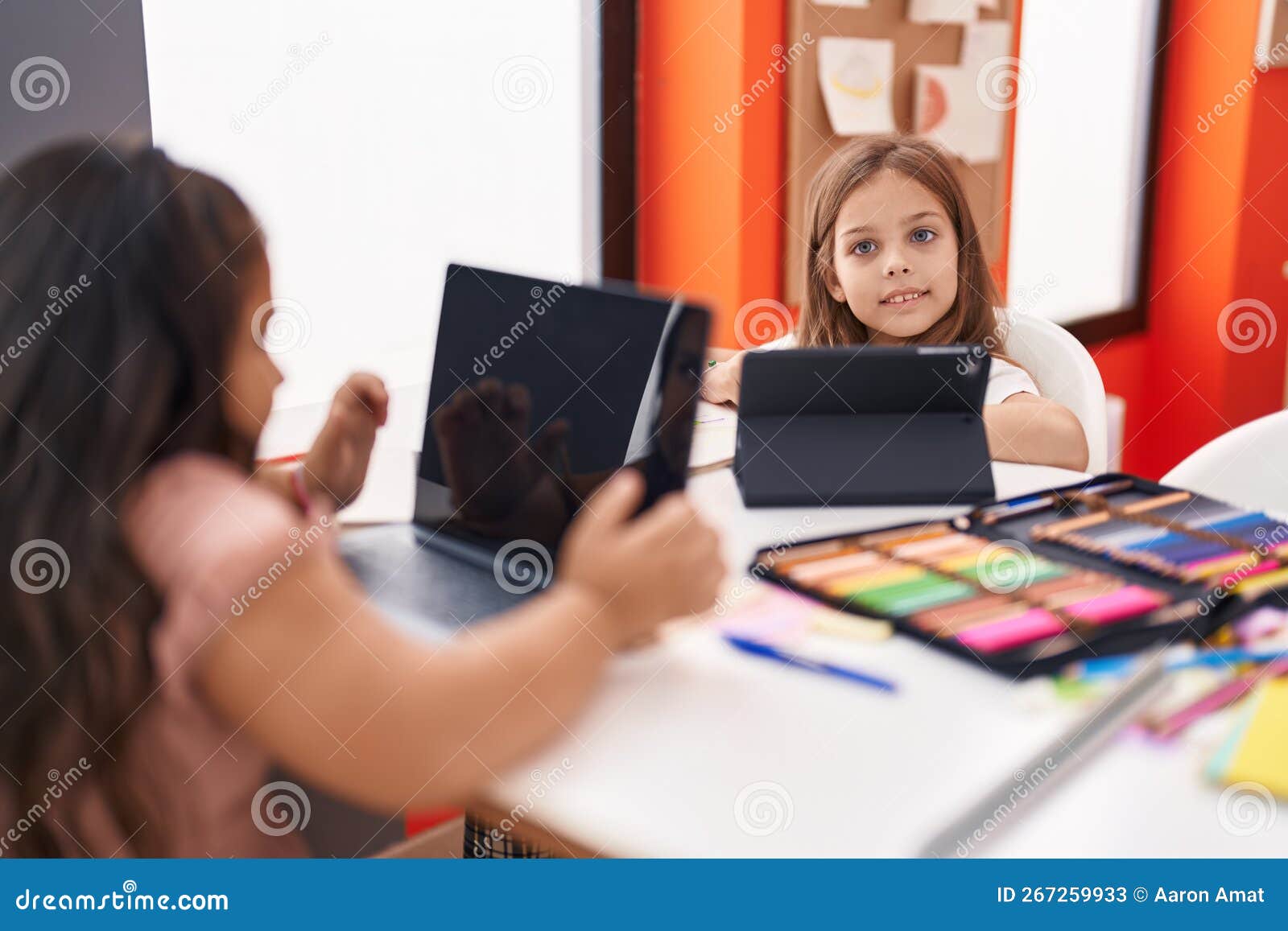 Two Kids Students Using Laptop and Touchpad Studying at Classroom Stock ...