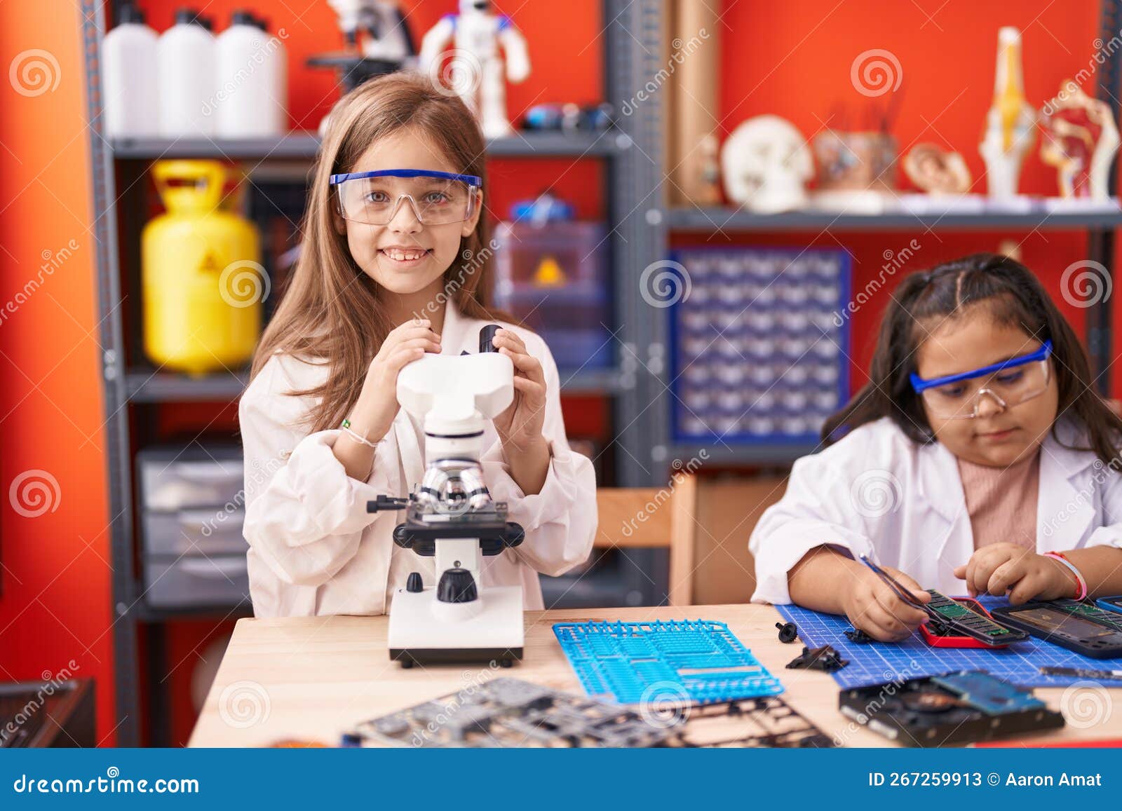 Two Kids Students Using Microscope Repairing Smartphone at Laboratory ...