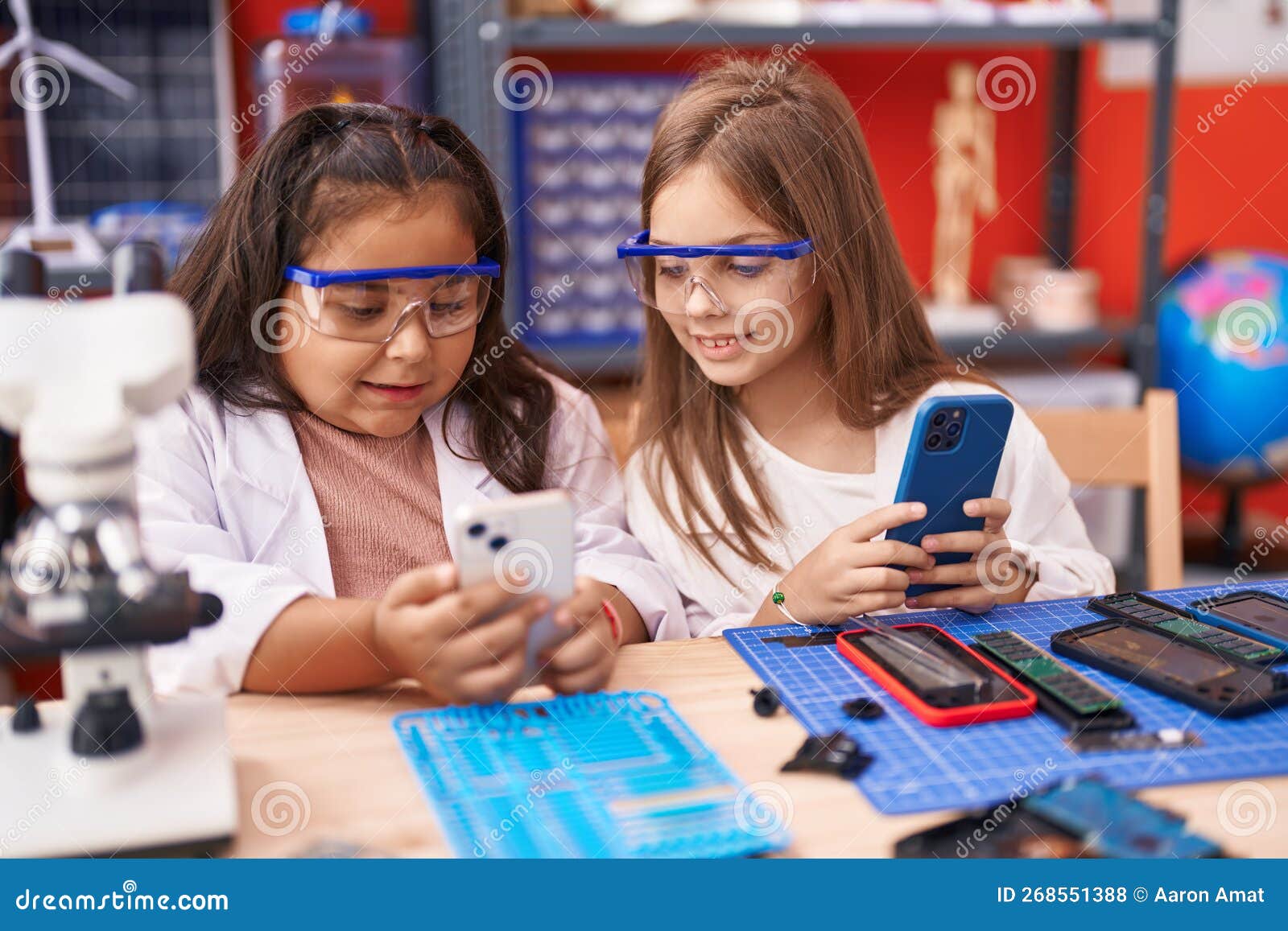 Two Kids Students Using Smartphones Standing at Laboratory Classroom ...