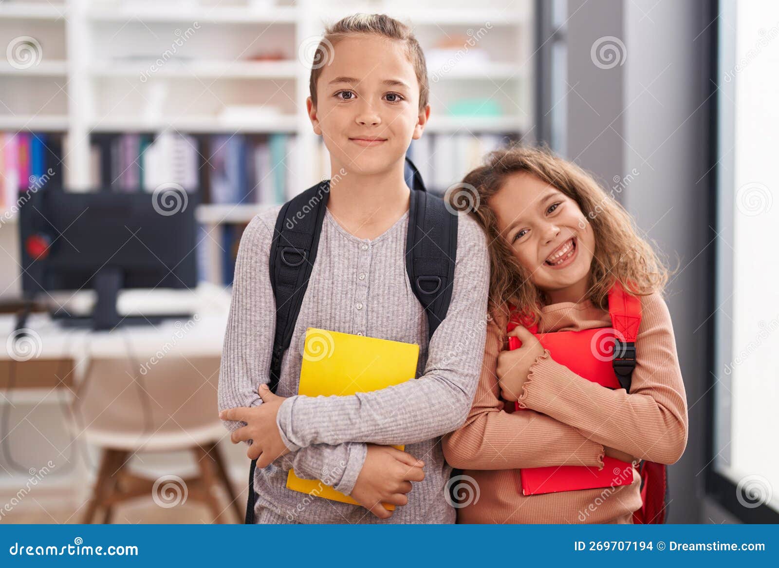 Two Kids Students Wearing Backpack Holding Book at Classroom Stock ...