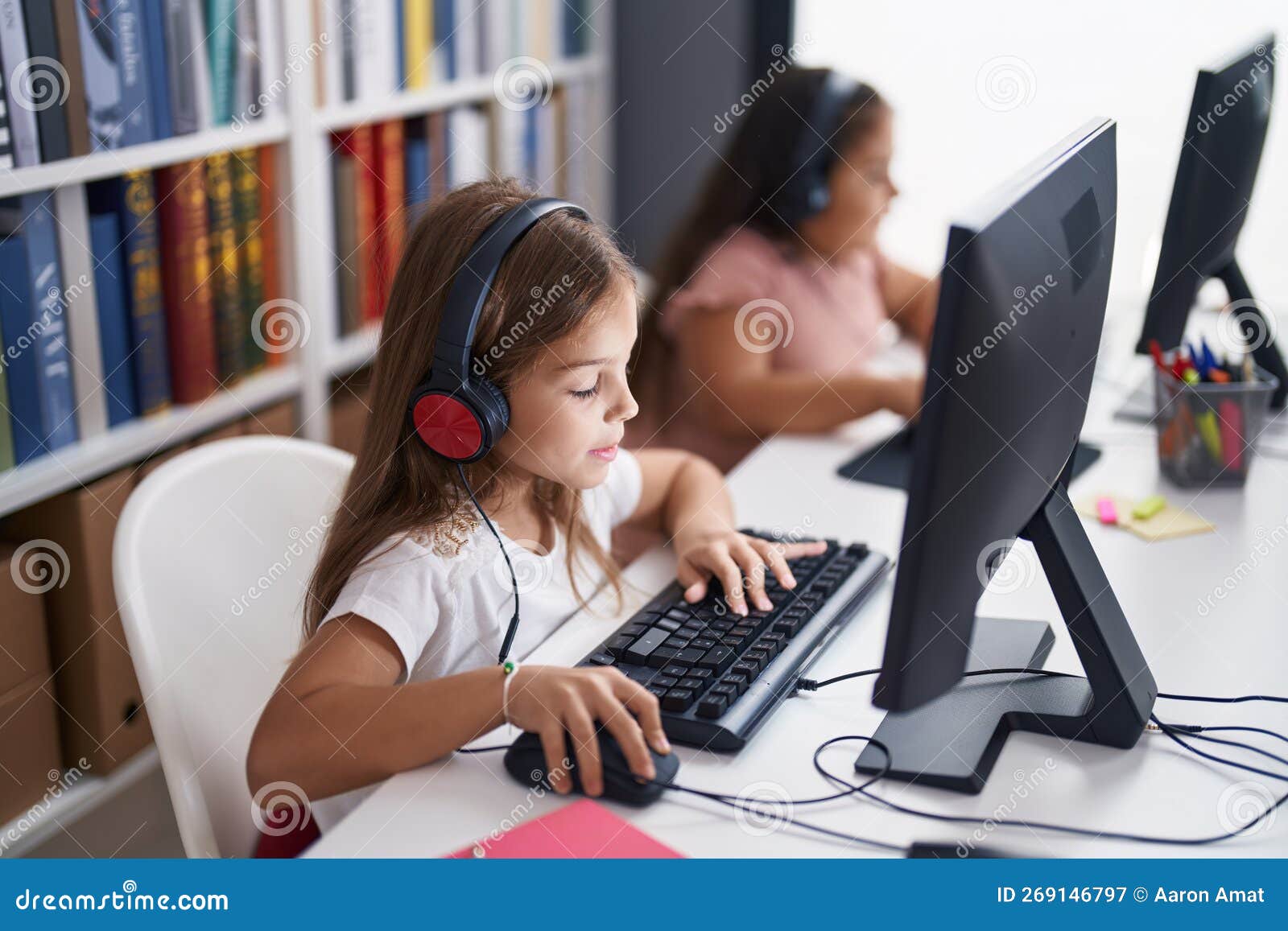 Two Kids Students Wearing Headphones Using Computer Studying at ...