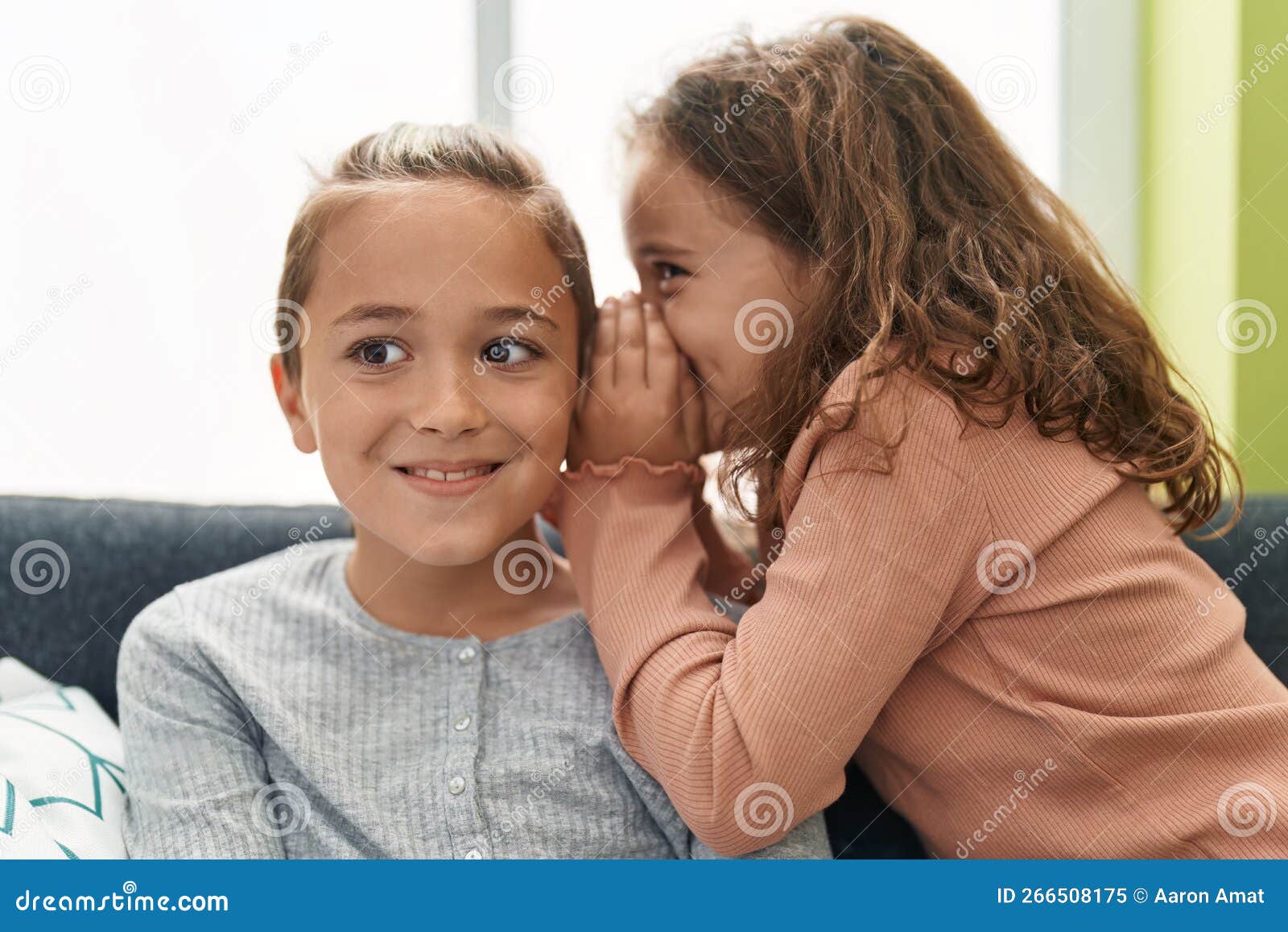 Two Kids Telling Secret Sitting on Sofa at Home Stock Image - Image of ...