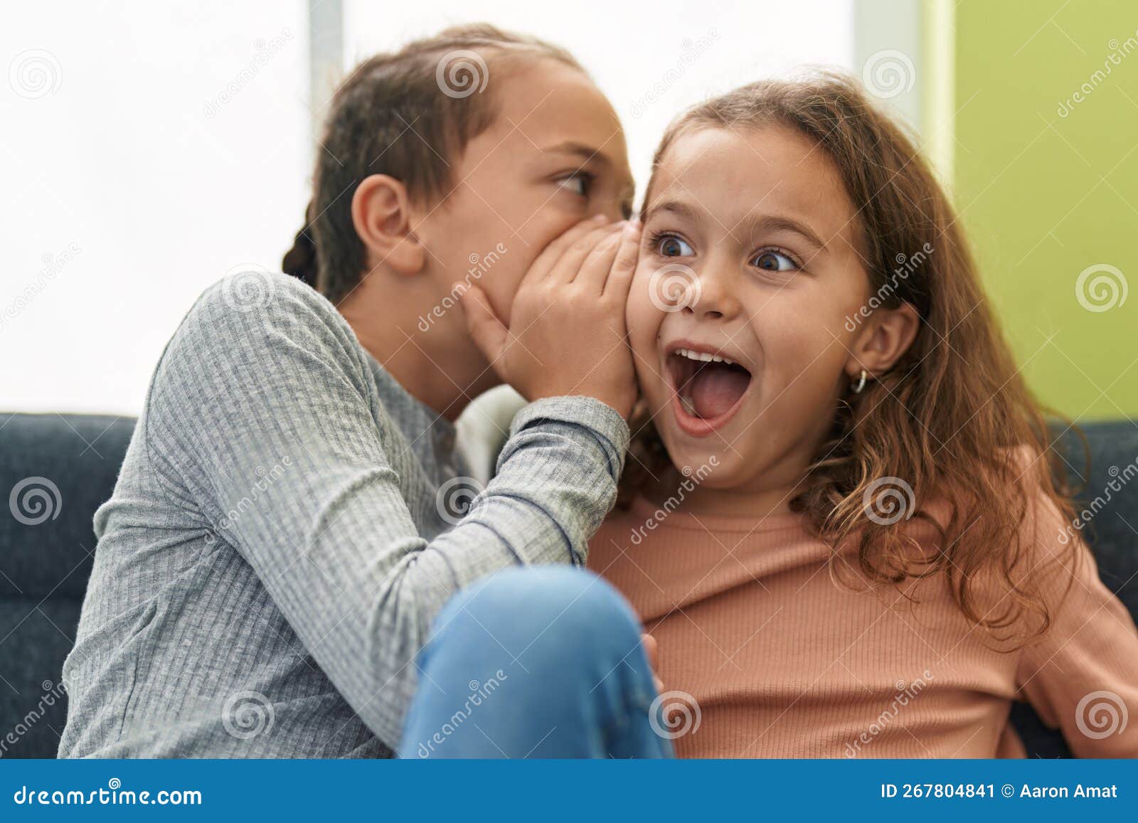 Two Kids Telling Secret Sitting on Sofa at Home Stock Image - Image of ...