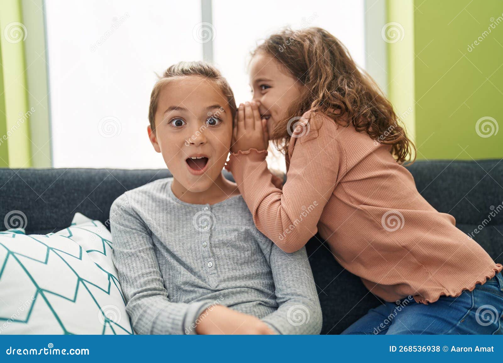 Two Kids Telling Secret Sitting on Sofa at Home Stock Photo - Image of ...