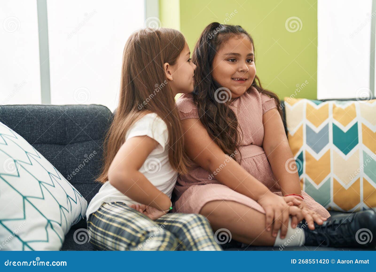 Two Kids Telling Secret Sitting on Sofa at Home Stock Photo - Image of ...