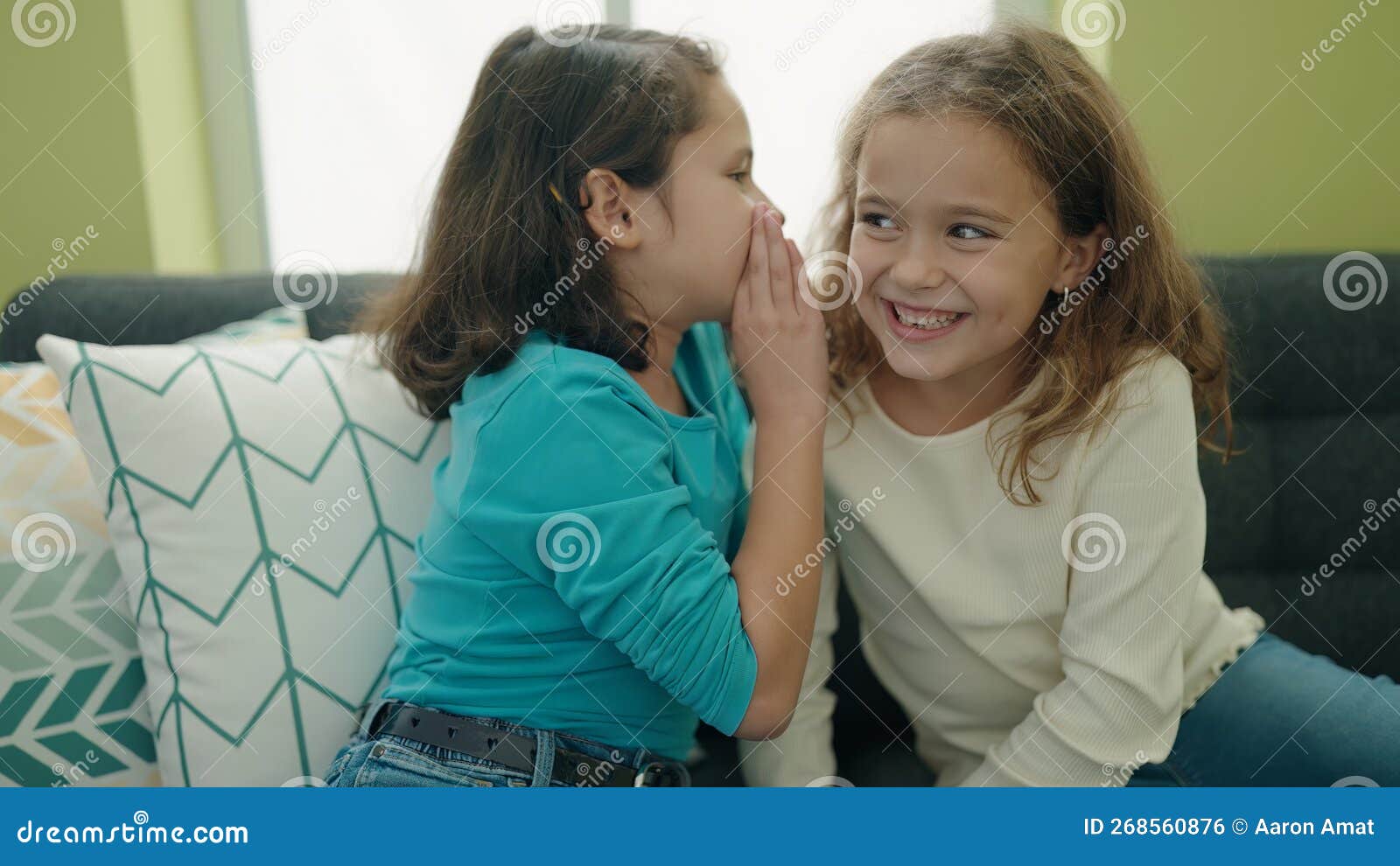 Two Kids Telling Secret Sitting on Sofa at Home Stock Photo - Image of ...