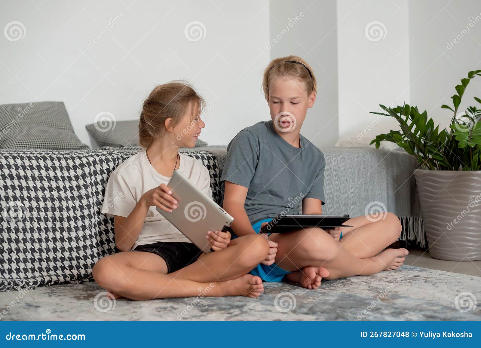 Two kids using tablet pc stock photo. Image of portable - 267827048
