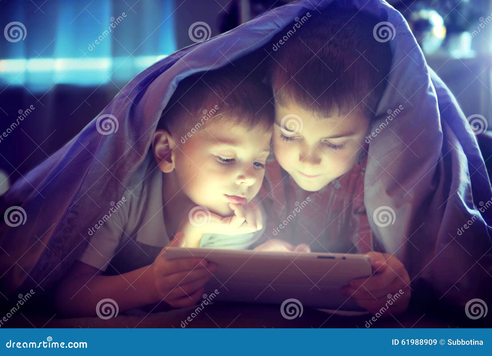 Two Kids Using Tablet Pc Under Blanket Stock Image - Image of blanket ...
