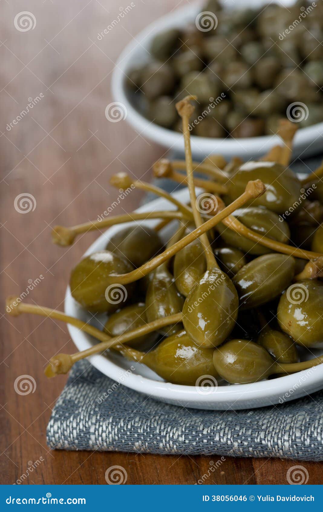 Two Kinds of Pickled Capers on Wooden Table Stock Photo - Image of ...