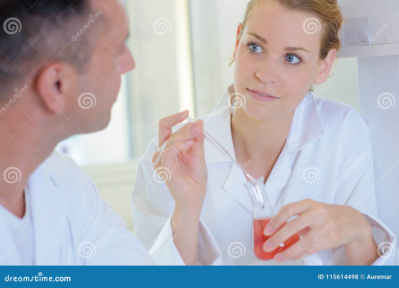 Two Lab Technicians in Discussion Stock Photo - Image of flask, working ...