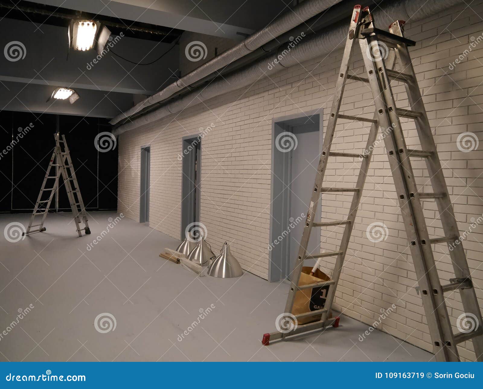 Two ladders in a studio stock image. Image of beige - 109163719