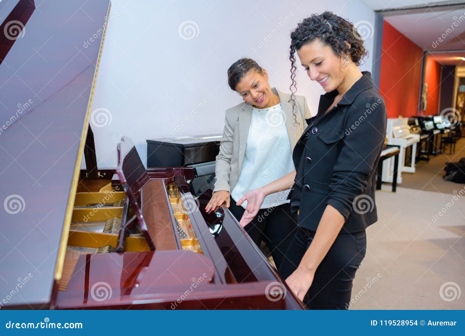 Two Ladies Looking at Piano Stock Photo - Image of play, piano: 119528954
