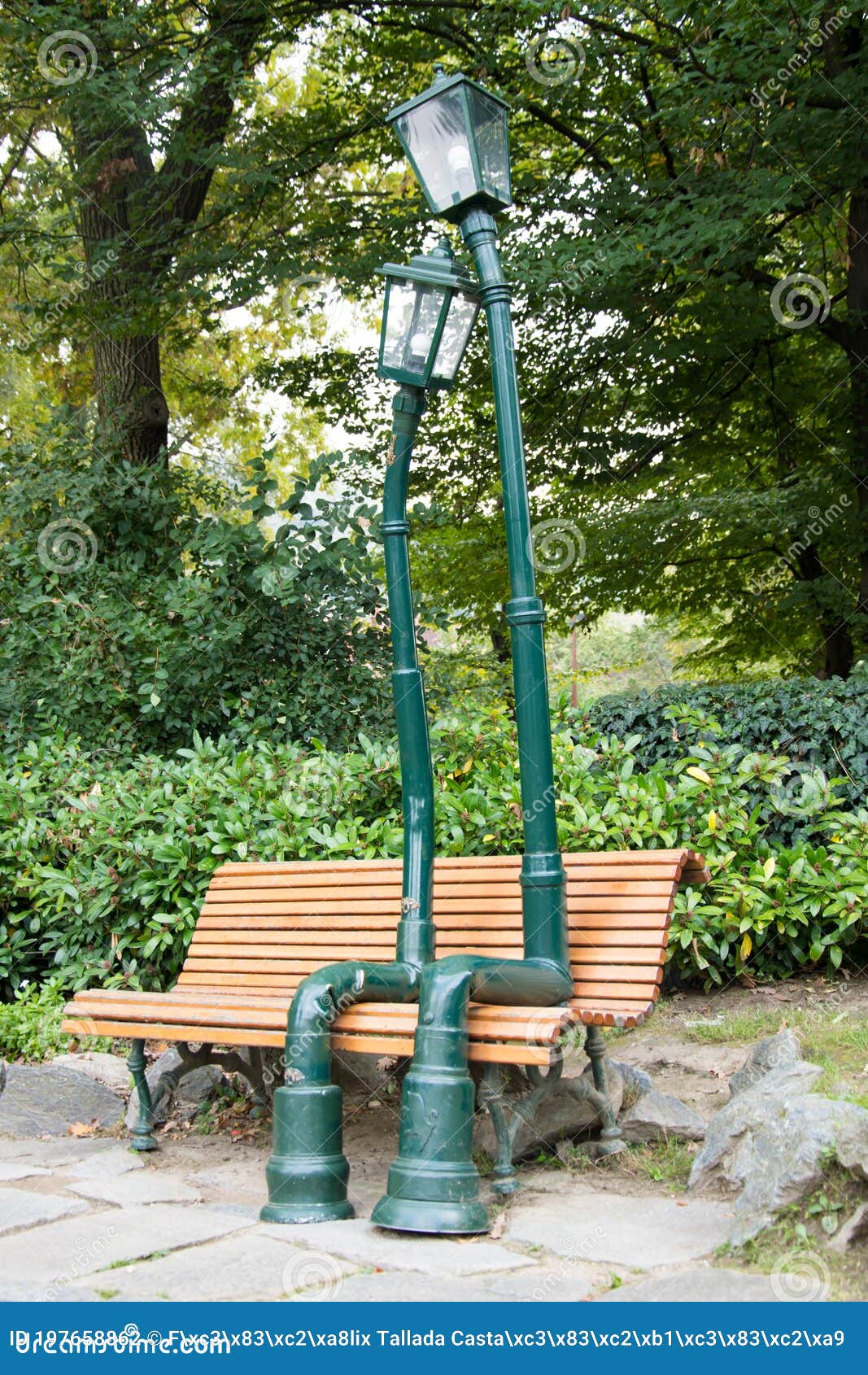 Two Lampposts Resting on a Bench Stock Photo - Image of sunlight, love ...