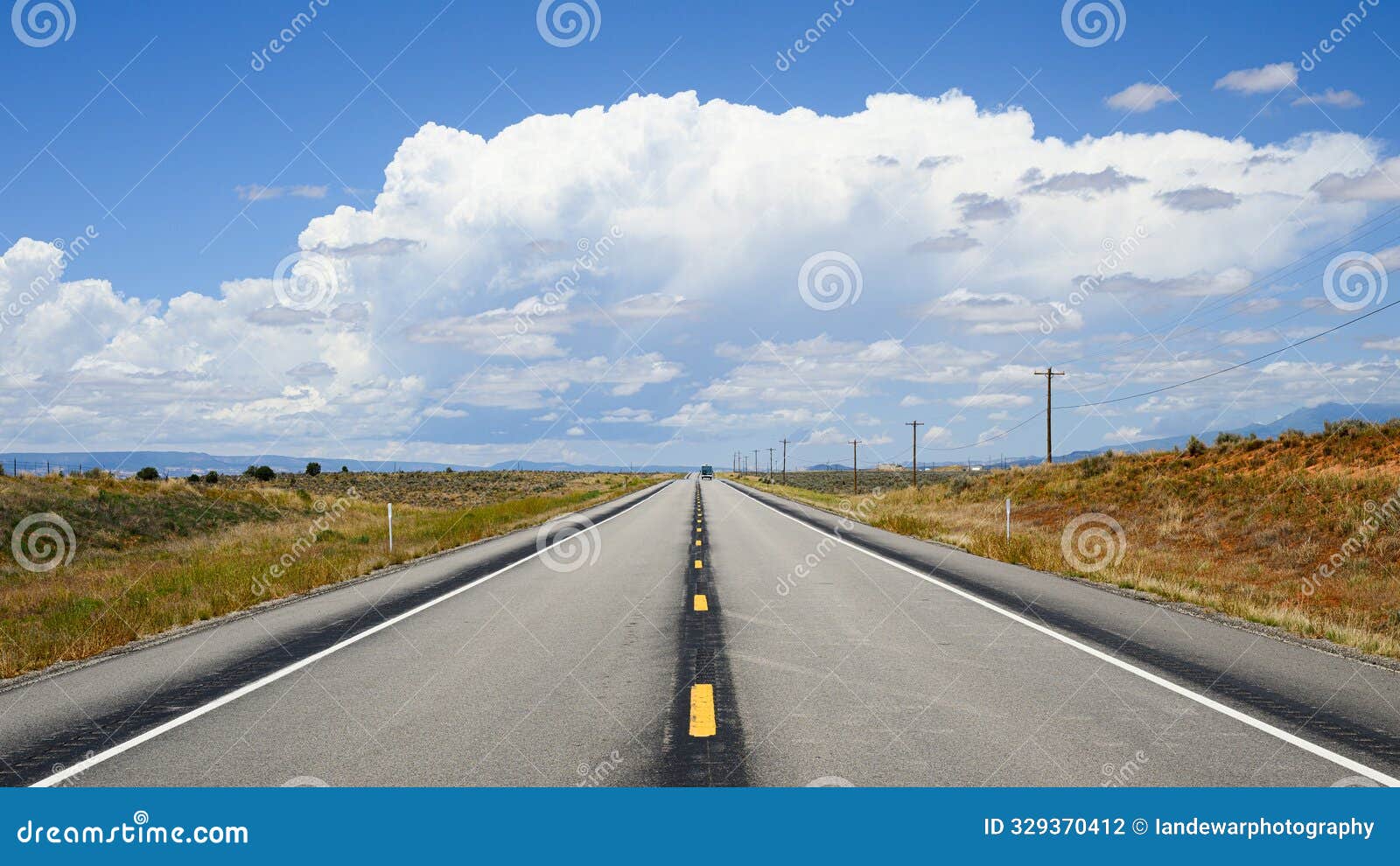 Two Lane Road Passing Open High Desert Towards Large White Cloud Stock ...