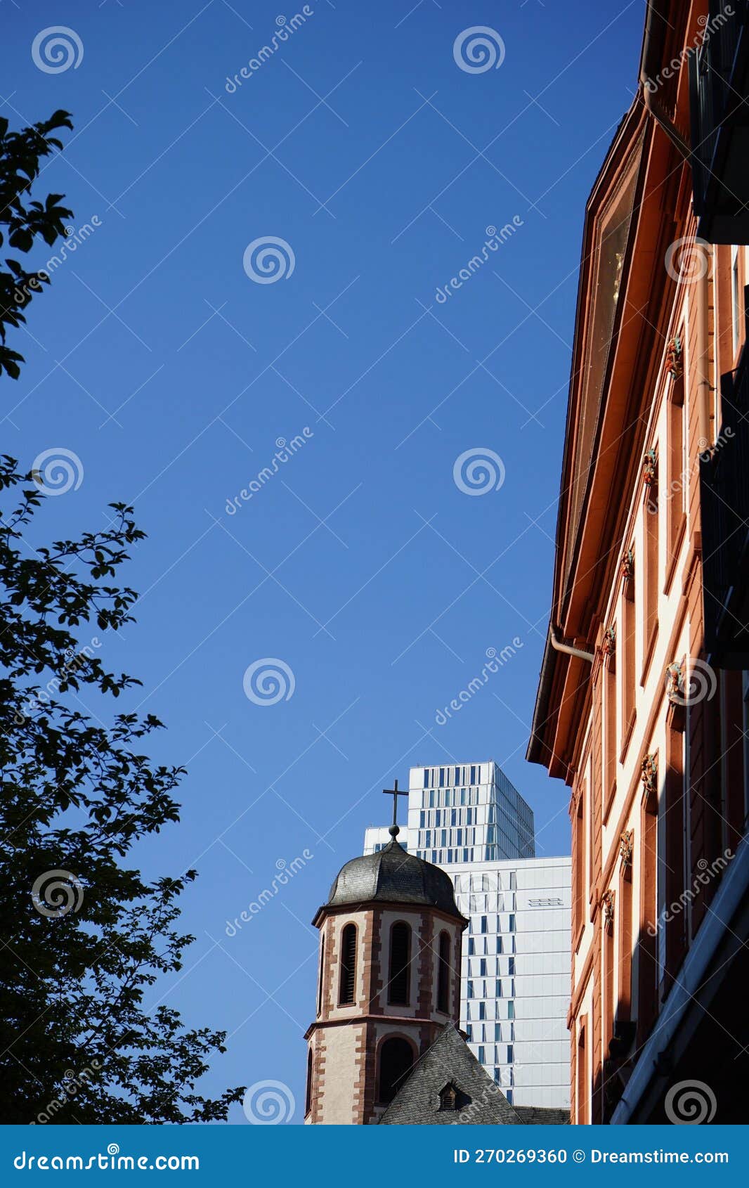 Two Buildings with a Tower and a Clock on Each of Them Stock Photo ...