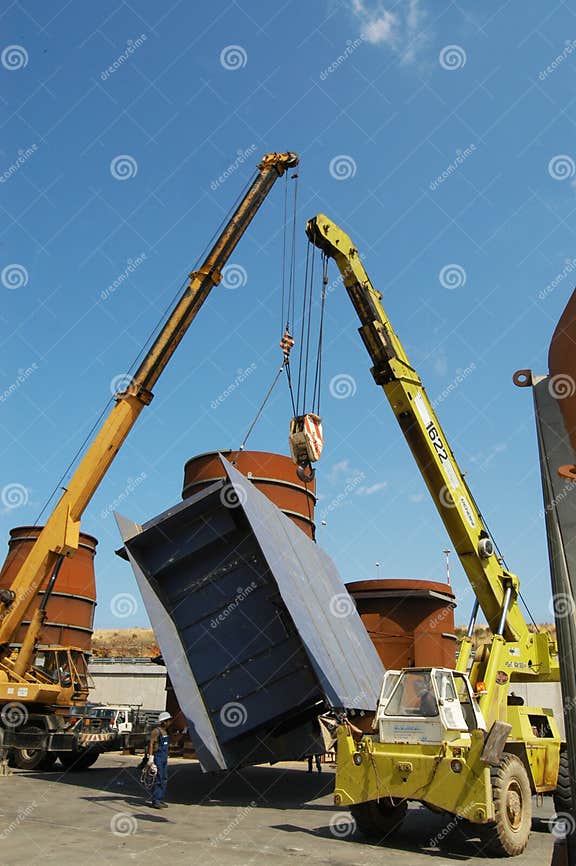 Two Large Cranes Move and Move Two Large Pipes for Pipe Construction ...