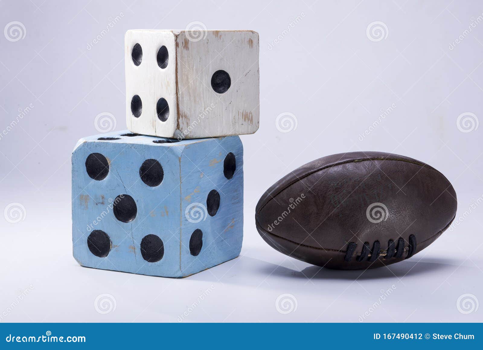 Two Large Dice and a Rugby Close-up on White Background Stock Photo ...