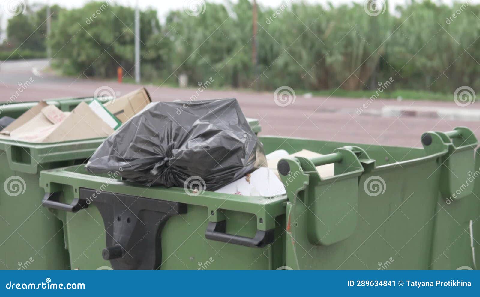 Two Large Garbage Cans Stand on the Highway in Spain in the Summer ...