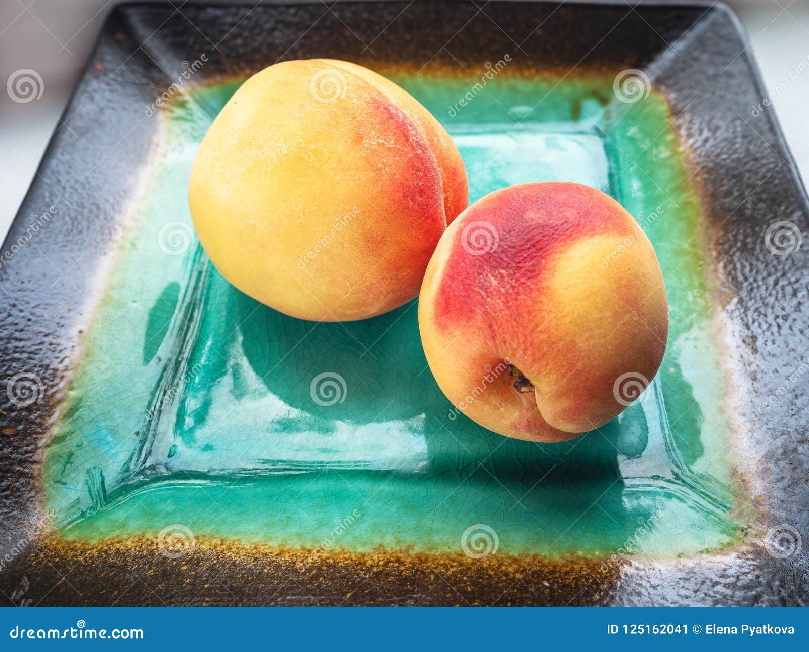 Two Large Ripe Peaches on a Ceramic Decorative Plate Stock Image ...