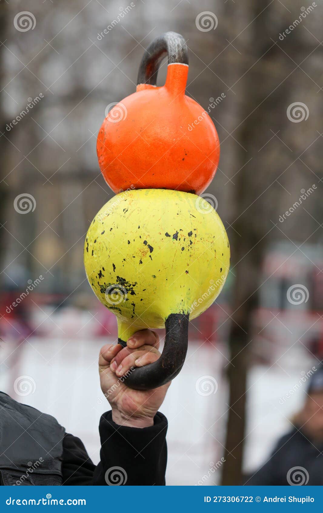 Two Large Round Metal Weights in the Hands of a Man Stock Photo - Image ...