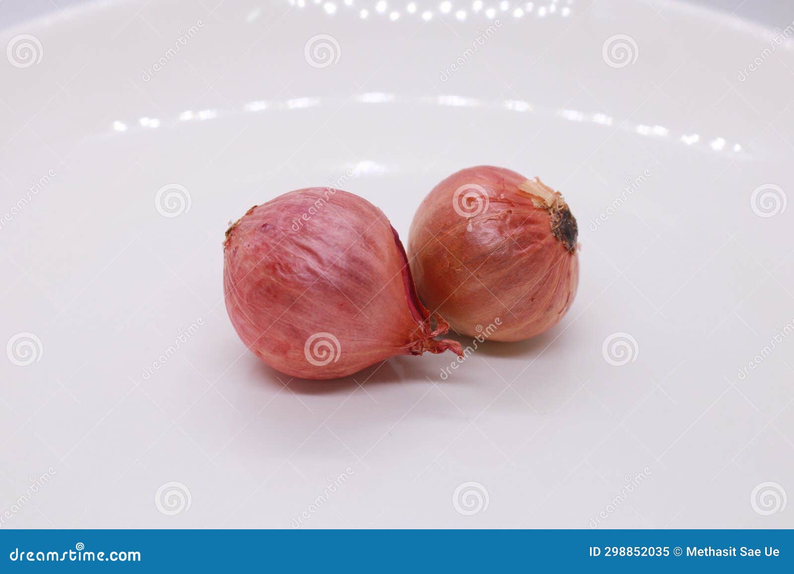 Two large shallot on plate stock image. Image of cooking - 298852035