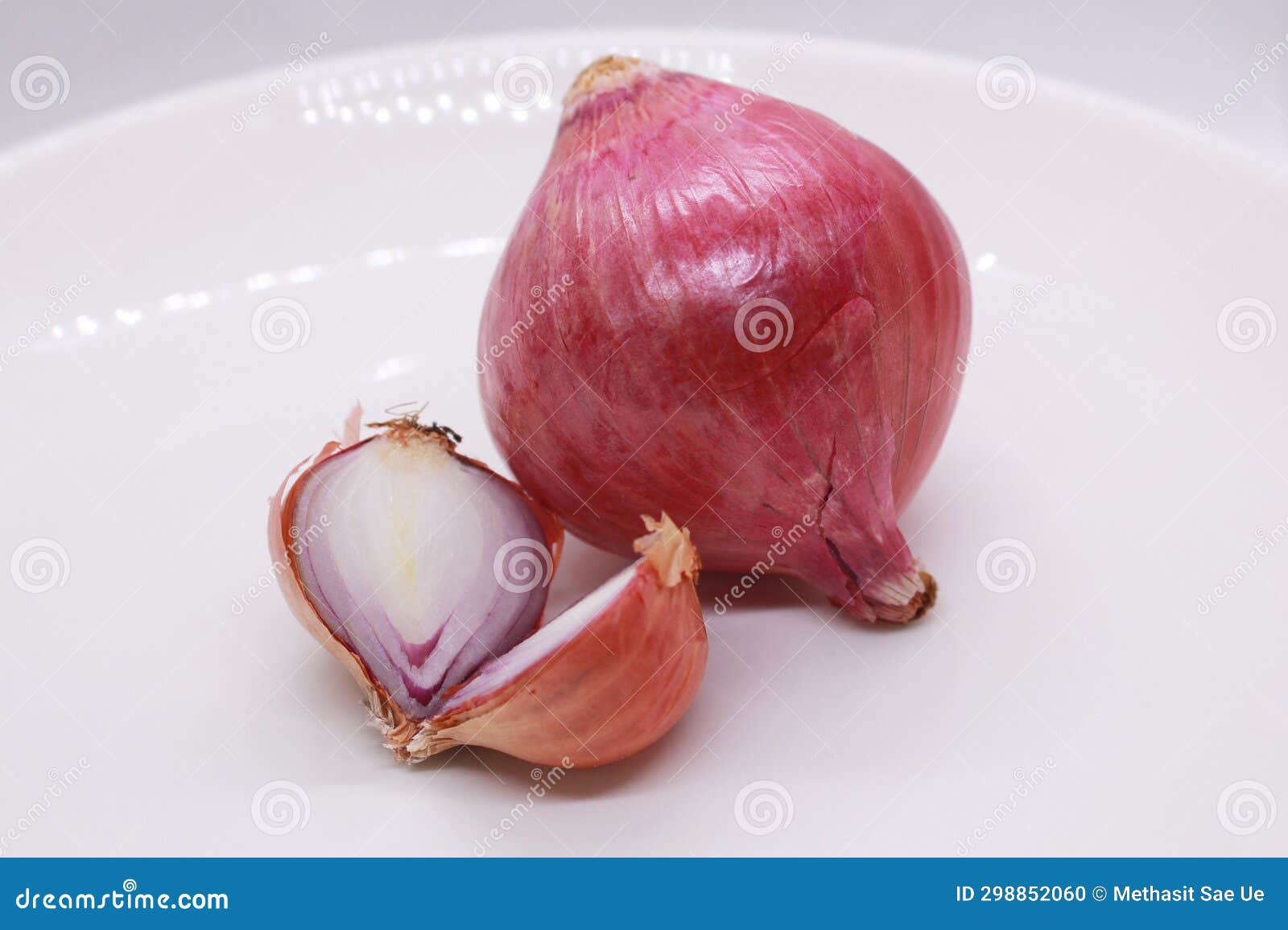 Two Large Shallots and One Onion, Cut on a Plate Stock Photo - Image of ...