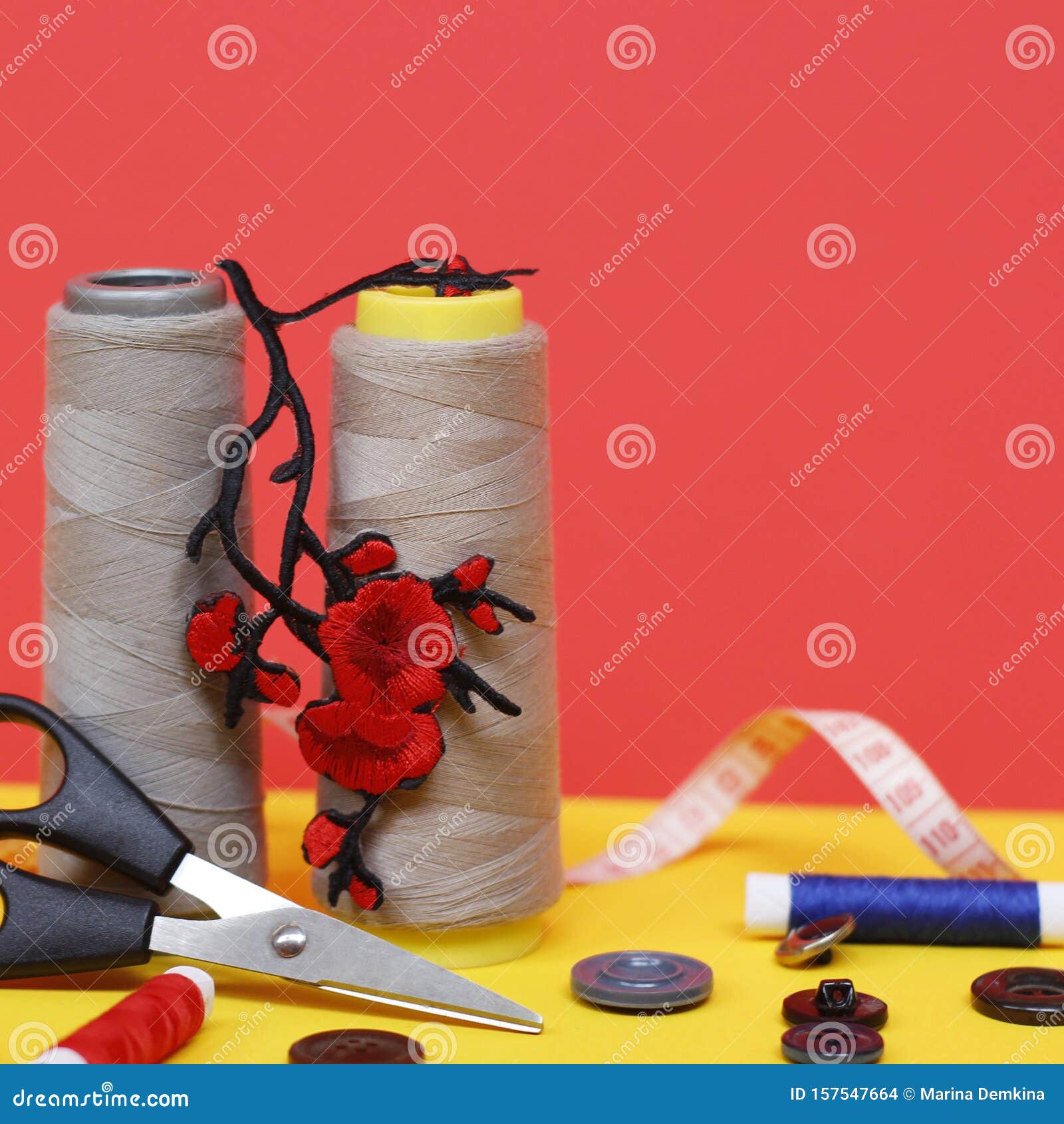 Two Large Spools of Thread are Standing, Many Small Spools are Lying ...