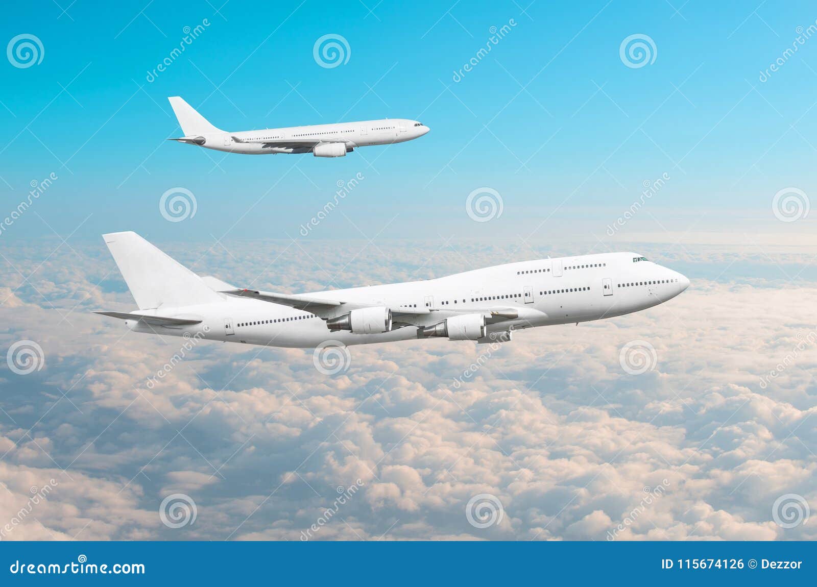 Two Large White Passenger Airplanes Fly Parallel To Each Other in the ...