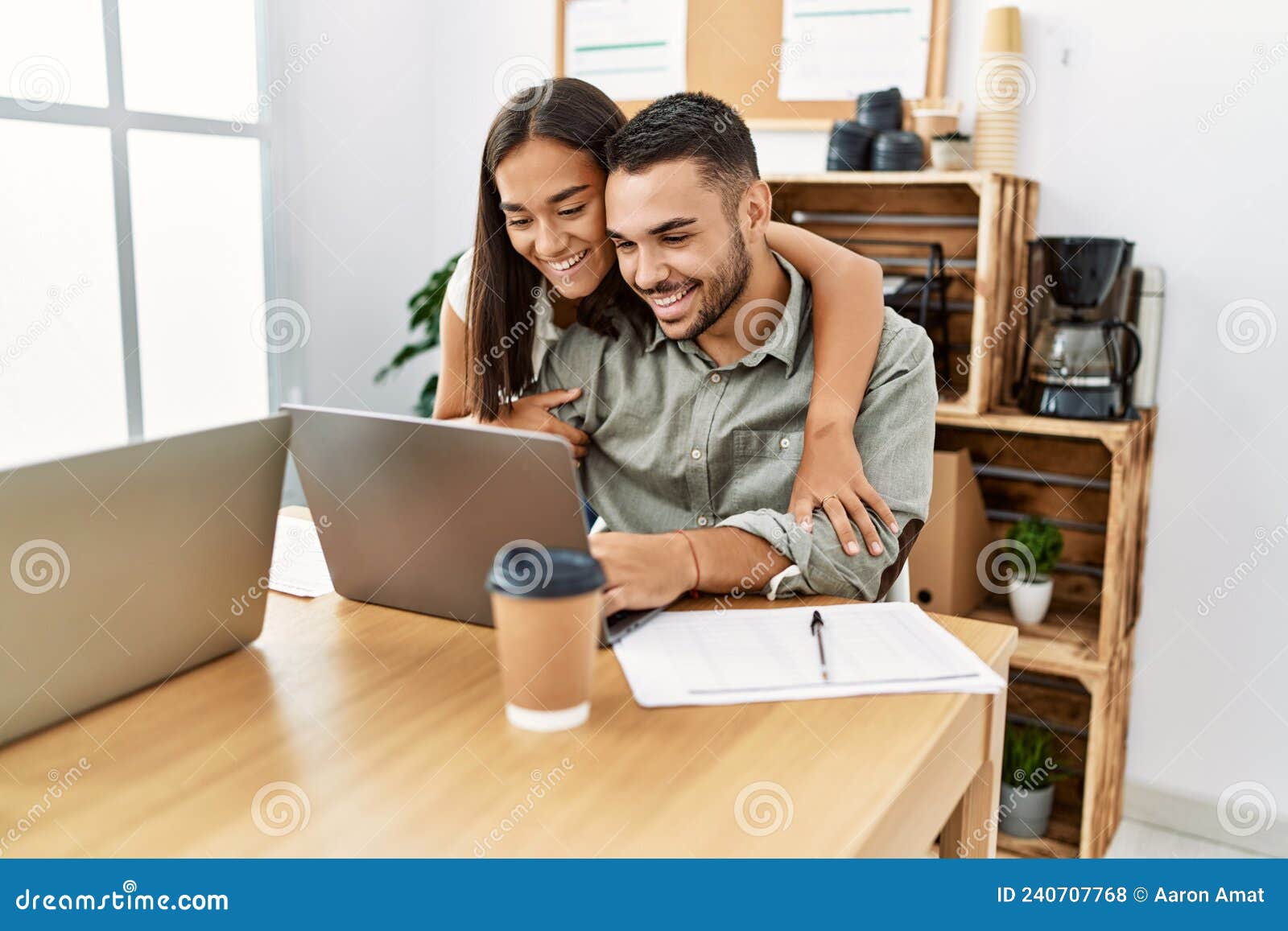 Two Latin Business Workers Smiling Happy and Hugging Working at the ...